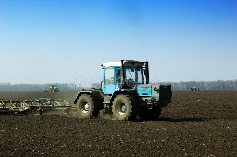 Tractor in the Field stock image. Image of blue, commodities - 13939531