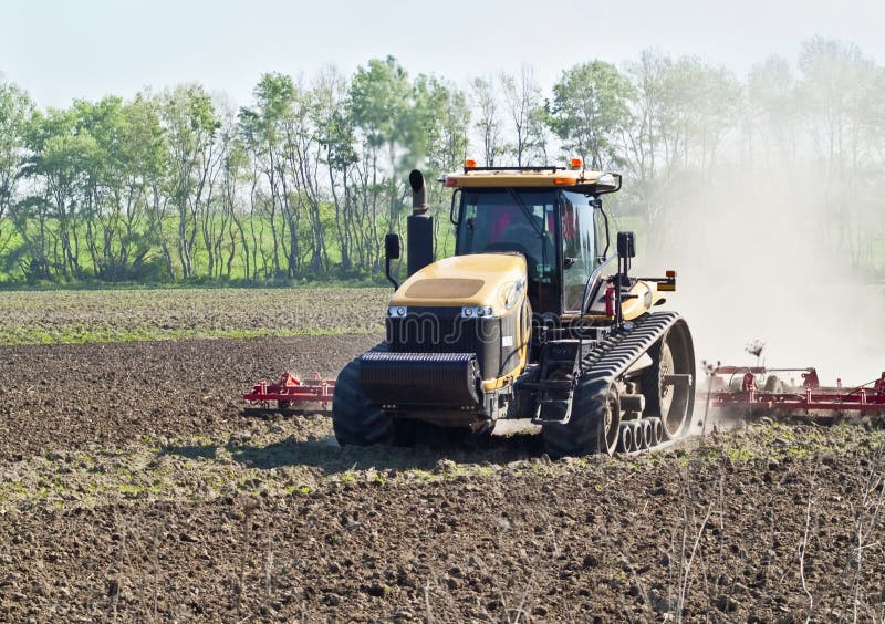 Tractor on a field stock photo. Image of countryside - 25571512
