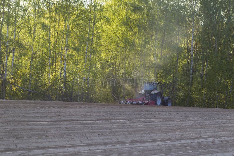 The Tractor in the Field on Agricultural Operations Stock Image - Image ...