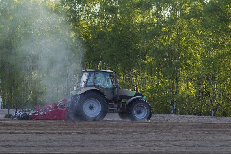 The Tractor in the Field on Agricultural Operations Stock Image - Image ...