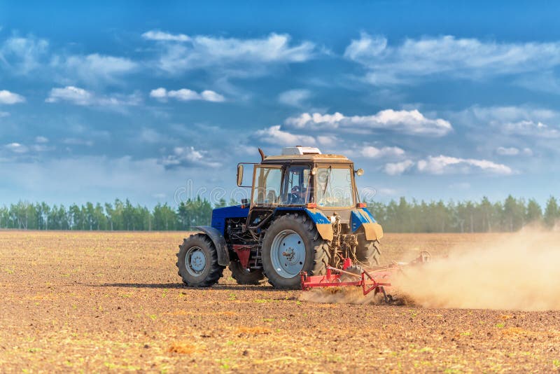 Tractor on the field stock photo. Image of dirt, agronomy - 26401376