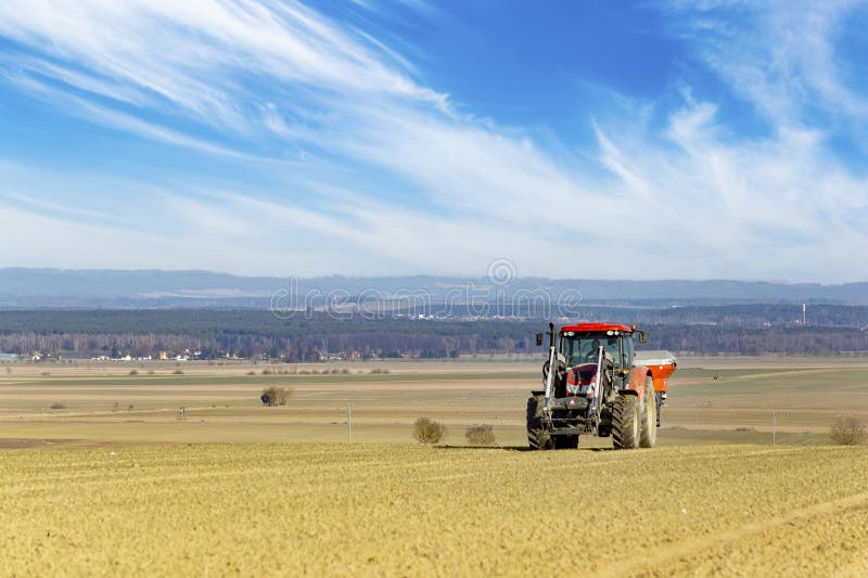 Tractor in a Field of the Early Spring Time Agricultural Activities ...