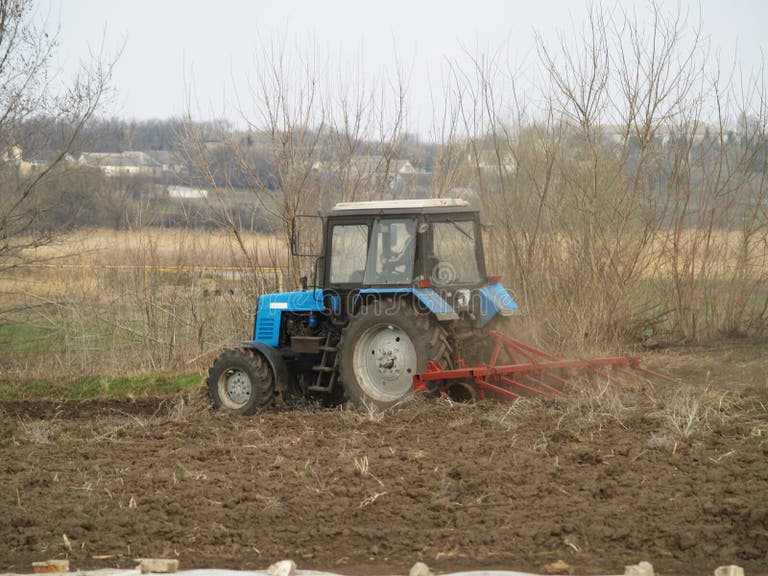 Tractor in a field stock image. Image of equipment, handling - 91116321