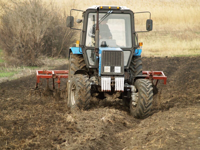 Tractor in a field stock photo. Image of handling, village - 91116400