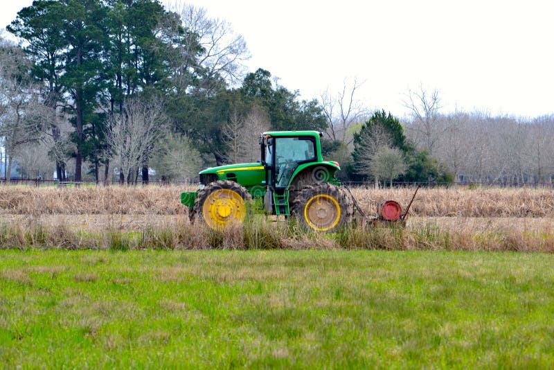 Tractor in a field editorial stock image. Image of field - 38680549