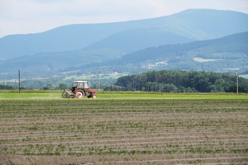 Tractor on the field stock photo. Image of mold, agriculture - 72921790