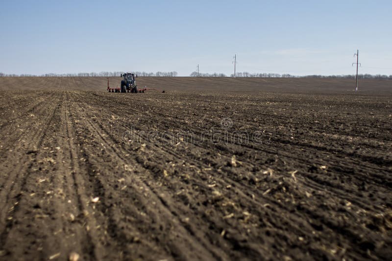 Tractor in the field sow stock photo. Image of dirt, machinery - 67788808