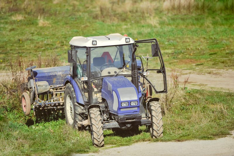 Tractor in the Field during Sowing Grain Stock Photo - Image of tractor ...