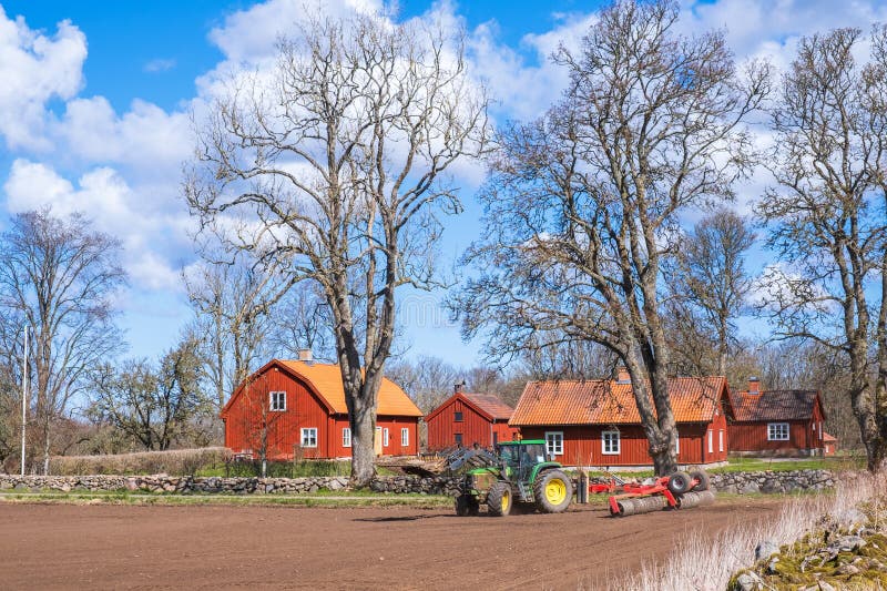 Tractor on a Field in Spring Farming at an Old Farm Editorial Photo ...