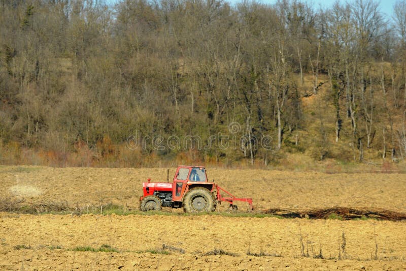 Tractor in the Field in Spring Editorial Stock Image - Image of ...
