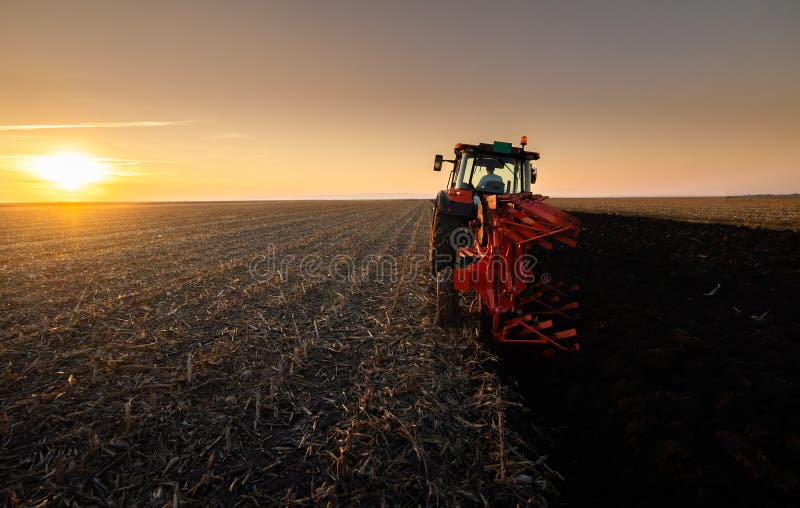 Tractor on the Field during Sunset Stock Image - Image of machine ...