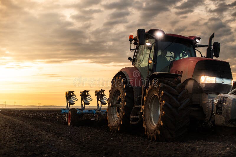 Tractor on the Field during Sunset Stock Photo - Image of industrial ...