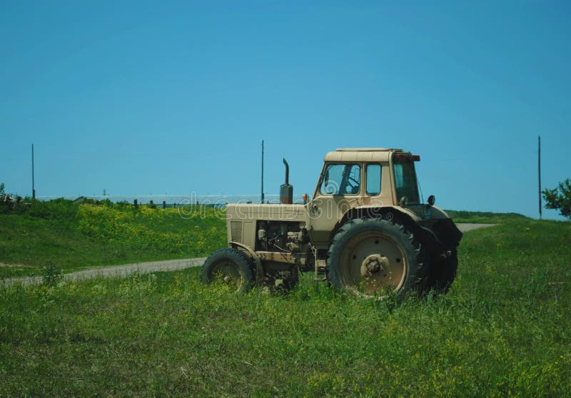Tractor in the field stock image. Image of tractor, grass - 224219421