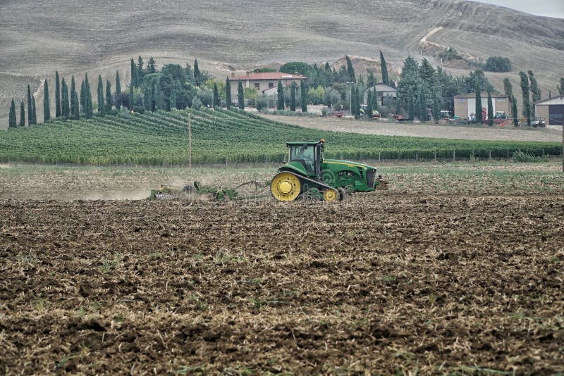Tractor on a Field in Tuscany Area of Italy Editorial Stock Photo ...