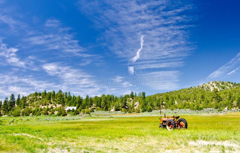Tractor in a Field in Utah stock image. Image of blue - 30509795