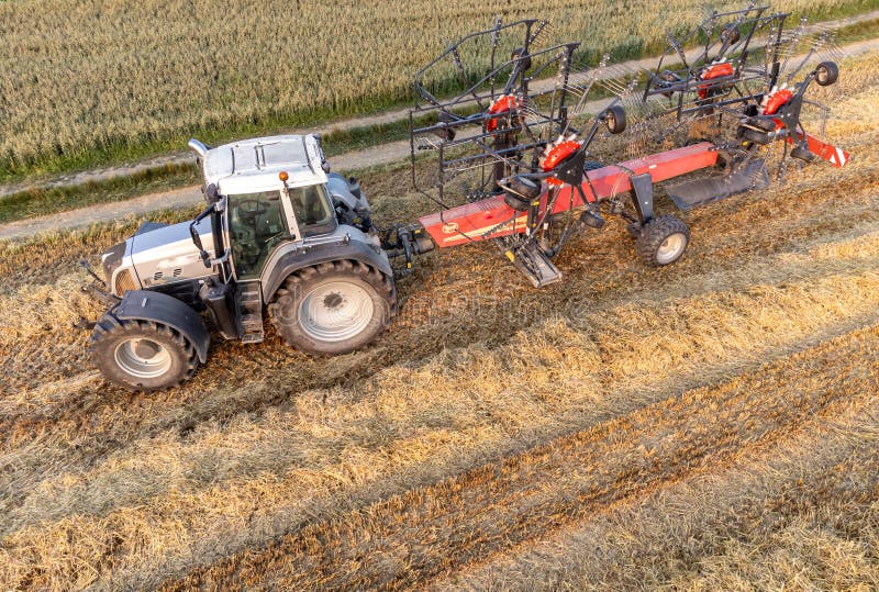Tractor on a grain field stock photo. Image of driving - 225176298
