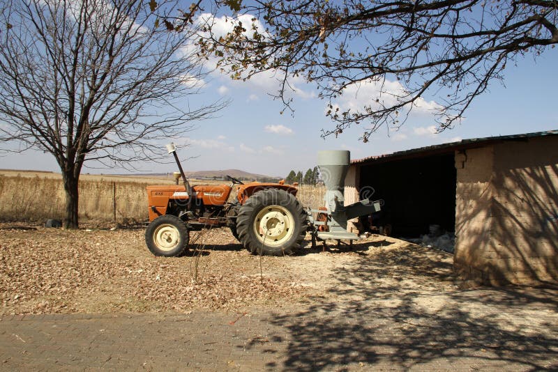 A Tractor and a `hammermeul` in Front of an Old Store on a Farm Stock ...