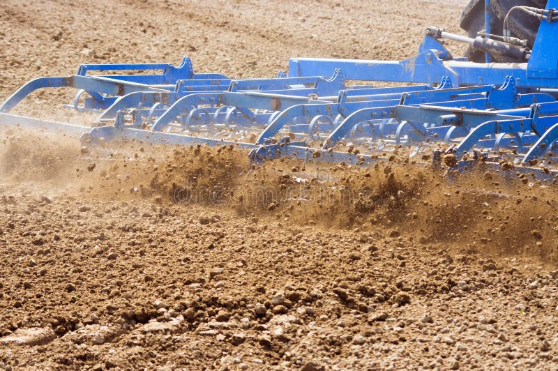 Tractor harrowing closeup stock image. Image of harrow - 41586761