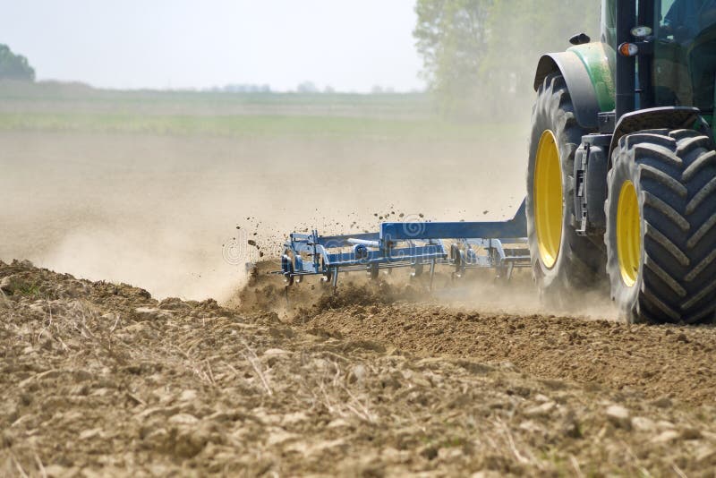 Tractor Harrowing Land in Springtime Stock Photo - Image of cultivate ...