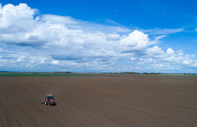 Tractor Harrowing Land in Springtime Stock Photo - Image of cultivate ...