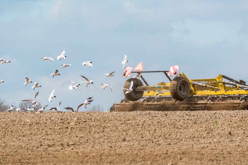 Tractor Harrowing the Field Stock Photo - Image of environment, green ...