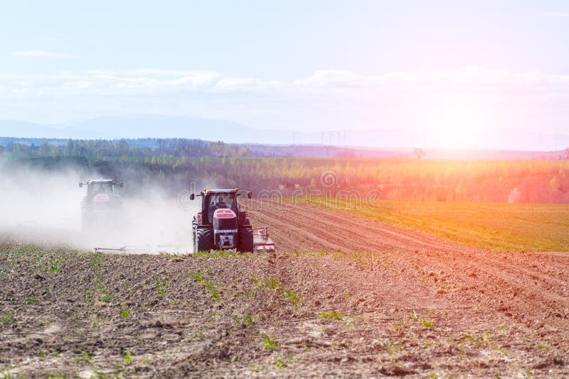 Tractor Harrowing the Field Stock Image - Image of plain, harrow: 54092619