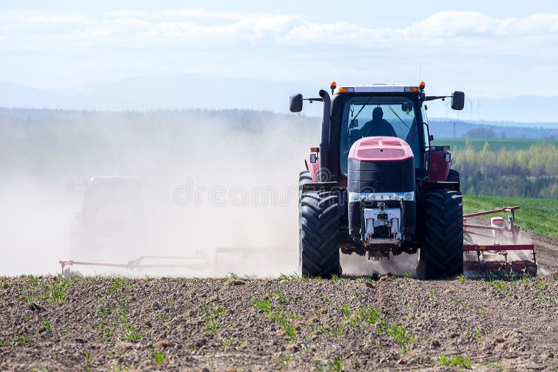 Tractor Harrowing the Field Stock Photo - Image of landscape, machine ...