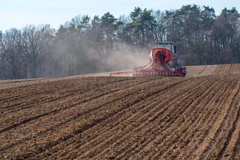 Tractor Harrowing the Field Stock Photo - Image of agronomy, industrial ...