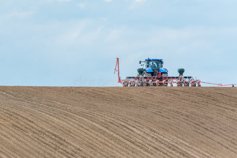Tractor Harrowing the Field Stock Photo - Image of nature, green: 81294216
