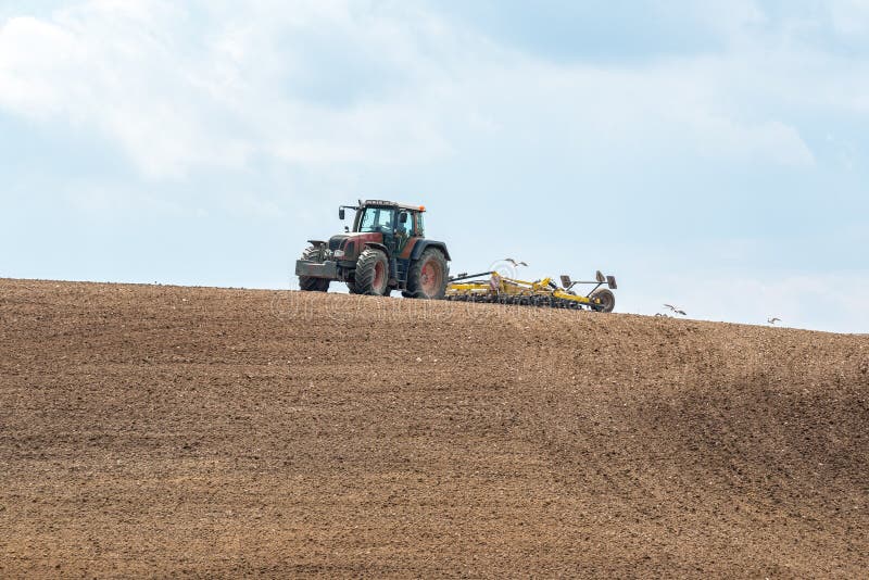 Tractor Harrowing the Field Stock Photo - Image of cultivating ...