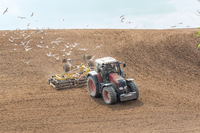 Tractor Harrowing the Field Stock Photo - Image of green, environment ...
