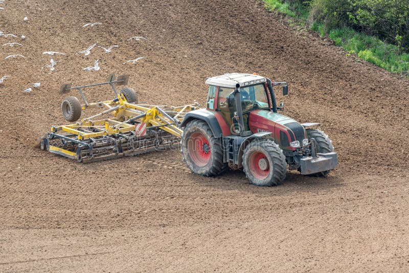 Tractor Harrowing the Field Stock Photo - Image of cultivator ...