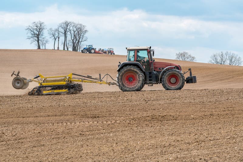 Tractor Harrowing the Field Stock Photo - Image of cultivator, land ...
