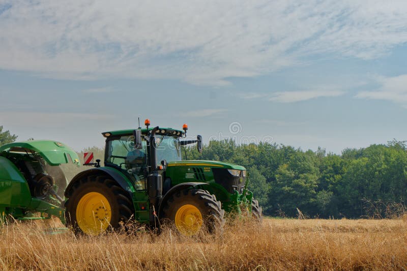 Tractor Harvesting Crop from the Field Editorial Stock Photo - Image of ...