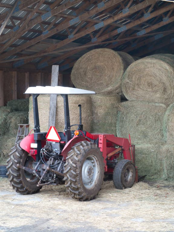 Tractor by the hay bails stock image. Image of countryside - 24270925