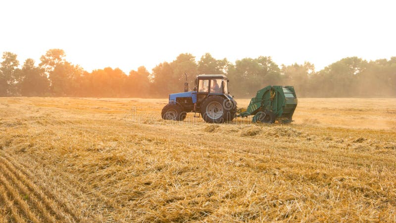 Tractor with Hay Bale Making Machine. Stock Image - Image of ...