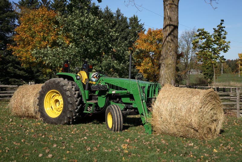 Tractor and Hay Bales editorial photo. Image of rural - 3444661