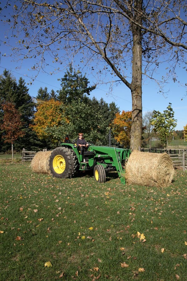 Tractor and Hay Bales editorial stock image. Image of autumn - 3444684