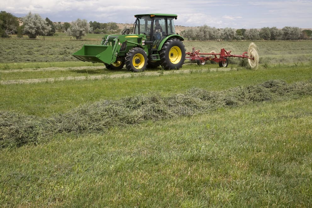 Tractor and hay rake editorial photo. Image of tractor - 10401751