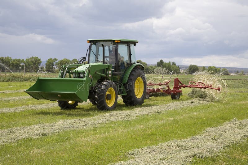 Tractor and hay rake editorial stock photo. Image of lifestyle - 10401818