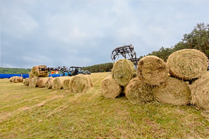 Tractor Hay Stacks in the Field. Toning Stock Image - Image of country ...