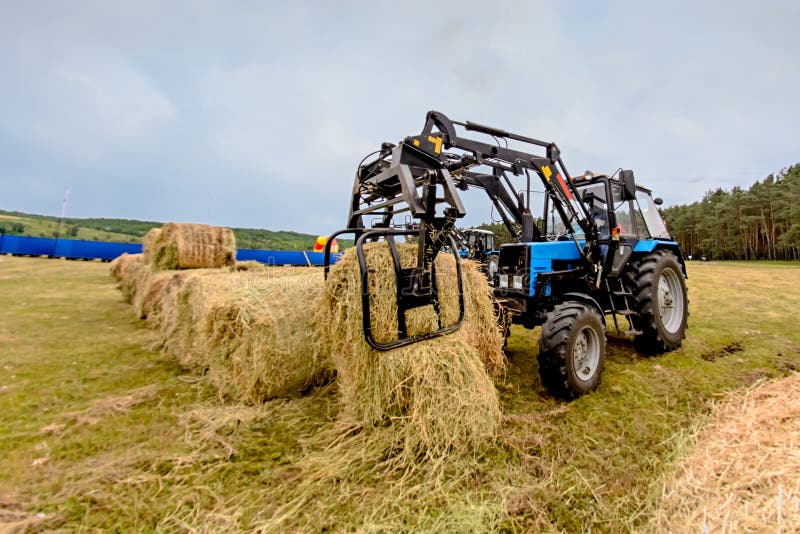 Tractor Hay Stacks in the Field. Toning Stock Photo - Image of autumn ...