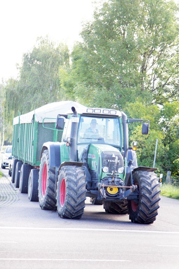 Tractor with a Large Metal Trailer on the Road Editorial Stock Photo ...