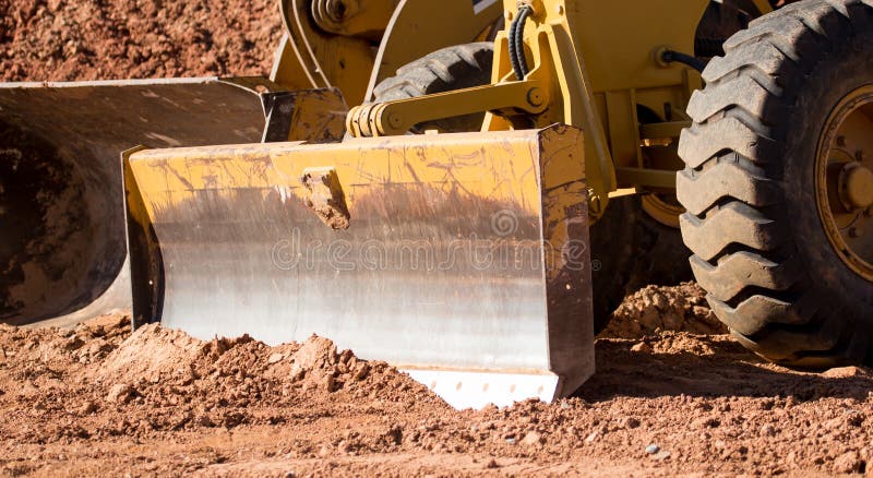 The Tractor is Leveling the Dirt Road Stock Photo - Image of ...
