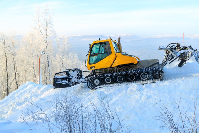 Tractor for Leveling Snow at Ski Resorts. Preparation of a Ski Track in ...