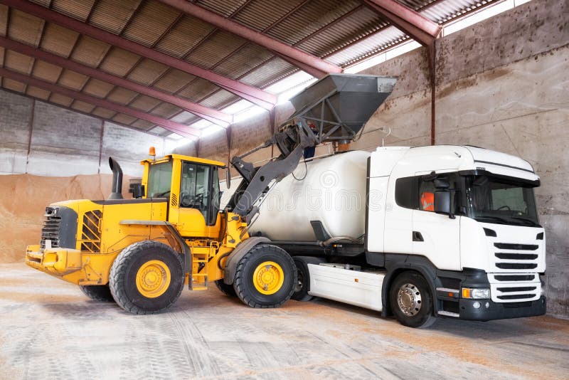 Tractor Loading Grain into Truck at at Grain Processing Plant Warehouse ...