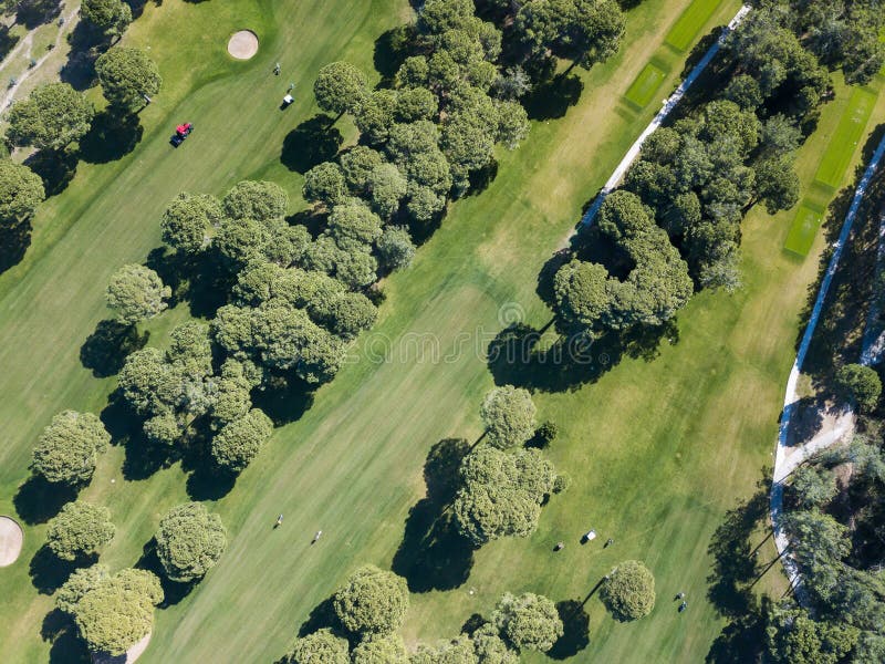 A Tractor with Loan Mower Working on a Golf Course Stock Image - Image ...