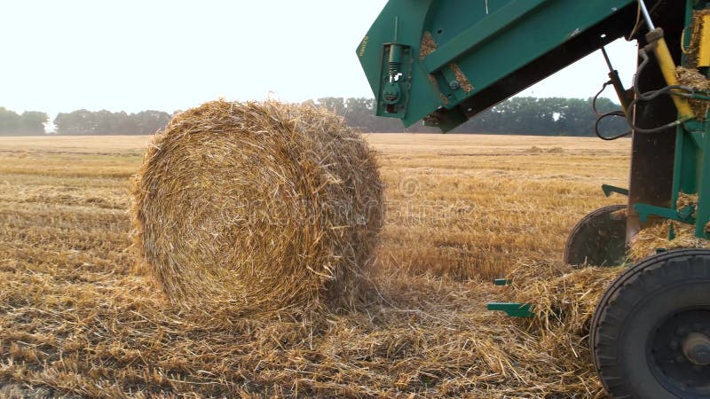 Tractor making hay bales. stock footage. Video of country - 122391256