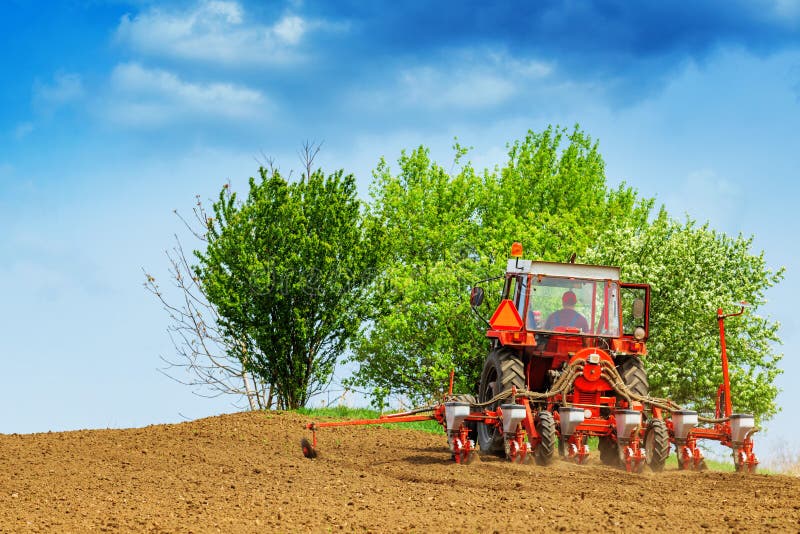 Tractor with Mounted Crop Seeder Stock Photo - Image of cultivated ...