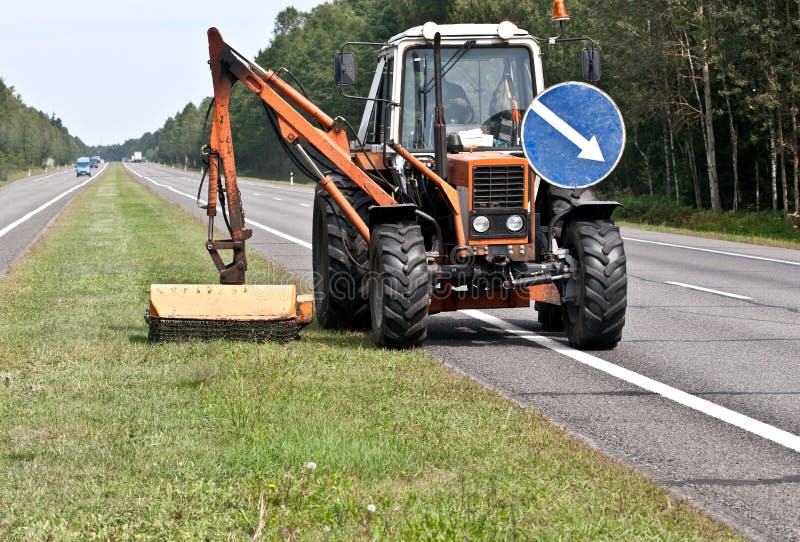 Tractor Pulling Lawn Mower Attachment Road Side Stock Photo - Image of ...